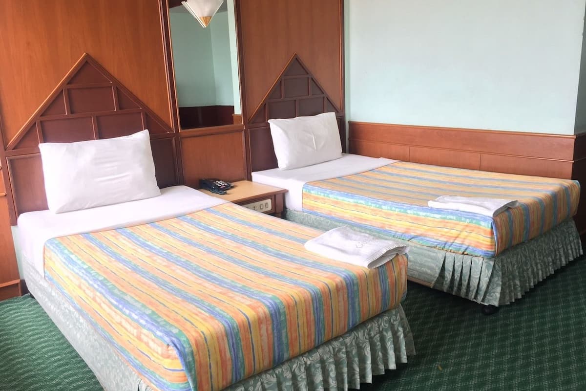 Quarto standard | Cortinas blackout, camas extras/dobráveis (sobretaxa), Wi-Fi de cortesia