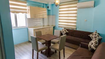 Apartamento elite, cozinha | Área de estar | TV LED