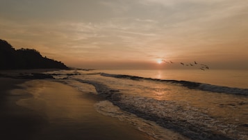 Na praia, toalhas de praia 