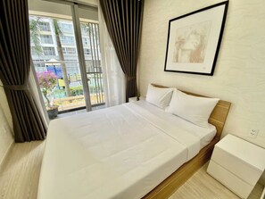 Apartamento grand | Roupas de cama premium, frigobar, individualmente decorados