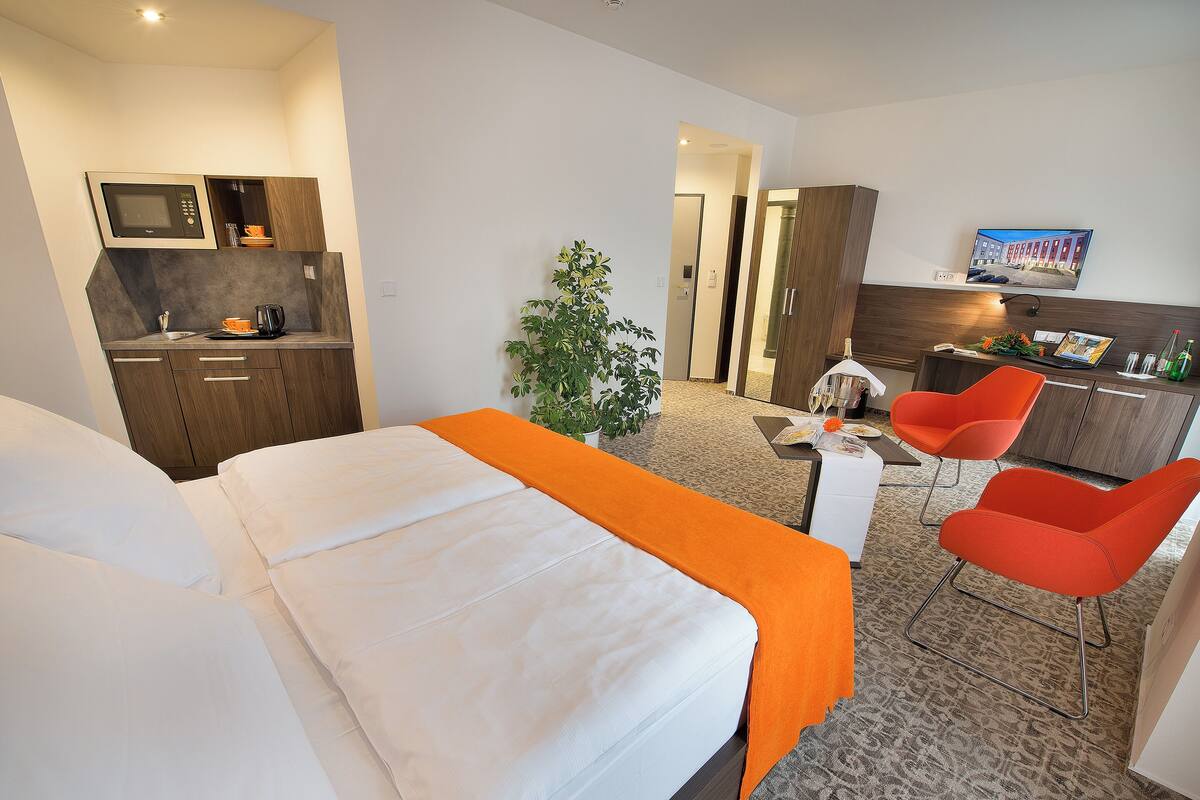Suite | Roupa hipoalergénica, minibar, cofre no quarto, secretária