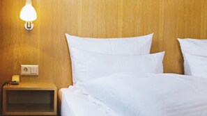 Quartos à prova de som, Wi-Fi de cortesia, roupa de cama