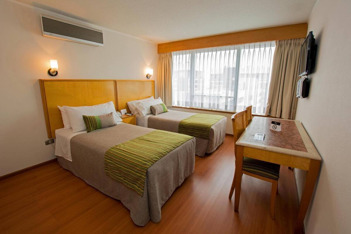 Cofres nos quartos, roupa de cama