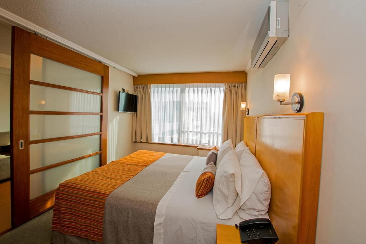 Cofres nos quartos, roupa de cama