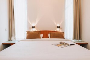 Suite Júnior | Minibar, cofre no quarto, quartos insonorizados, ferro/tábua de engomar 