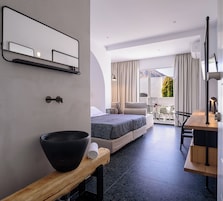 Suíte júnior | Cofres nos quartos, cortinas blackout, Wi-Fi de cortesia, roupa de cama