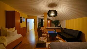 Suite Exclusiva | Sala de estar | Smart TV