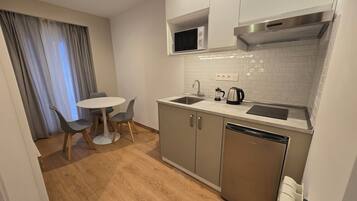 Estúdio | Área de estar | TV 32 polegadas com canais digitais