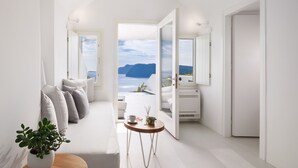 Quarto moderno e minimalista com vista para o mar, um sofá com almofadas, uma pequena mesa com uma planta e uma xícara, e uma porta que dá para outro cômodo.