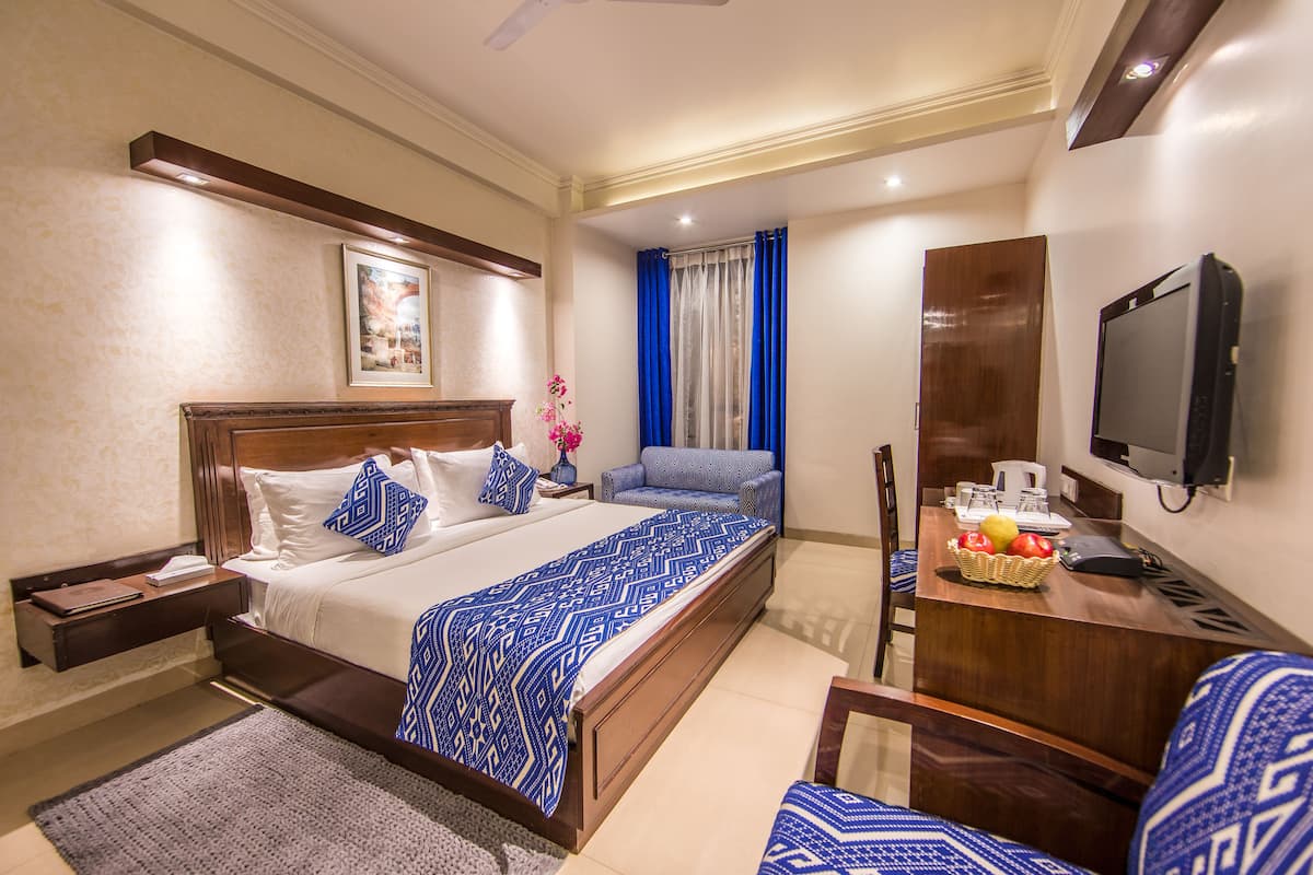 Suite Deluxe | Minibar, cofre no quarto, com decoração personalizada