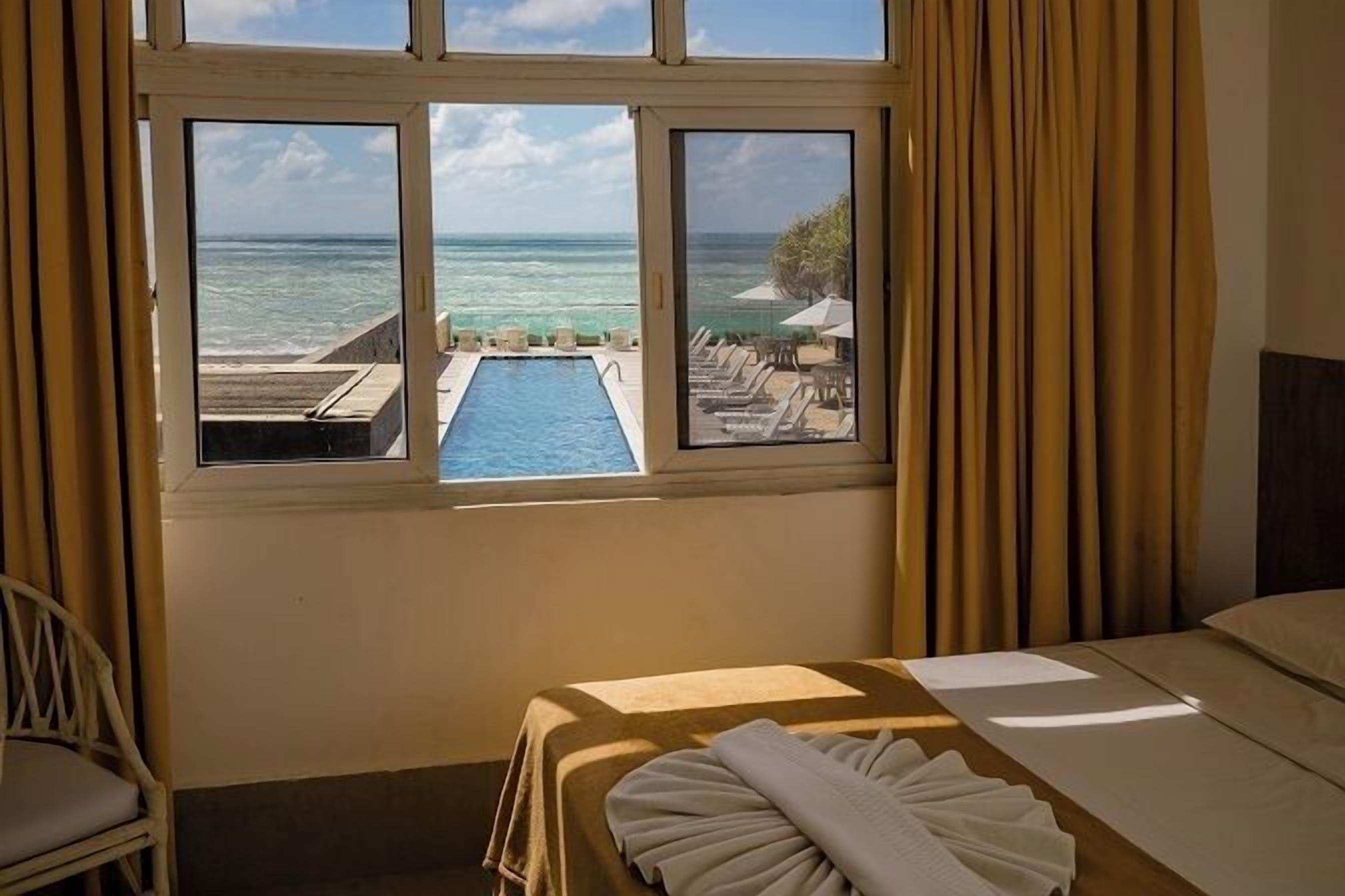 Quarto superior, vista para o oceano | Roupas de cama antialérgicas, frigobar, cofres nos quartos