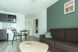 Apartamento conforto | Área de estar | TV de tela plana