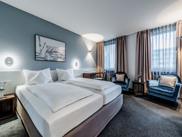 Quarto casal luxo | Área de estar | TV de tela plana