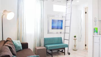 Apartamento, 1 quarto | Sala de estar | TV de ecrã plano