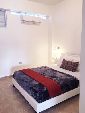 Apartamento, 2 quartos | 2 quartos, ferros/tábuas de passar roupa, Wi-Fi de cortesia