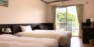 Quarto duplo | Frigobar, escrivaninha, quartos à prova de som, Wi-Fi de cortesia