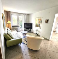 Apartamento luxo | Área de estar | TV de tela plana