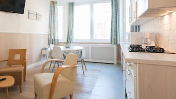 Apartamento conforto | Área de estar | TV