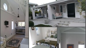 Um interior moderno com cozinha, sala de jantar com mesa e cadeiras, quarto com cama e mesa de cabeceira, e banheiro com vaso sanitário e pia.