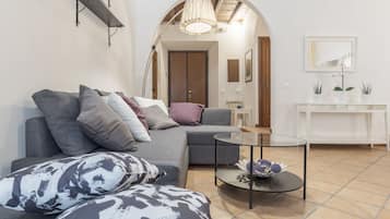 Apartamento, 1 quarto | Área de estar | TV de tela plana