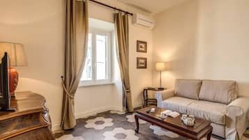 Apartamento, 1 quarto | Sala de estar | TV de ecrã plano