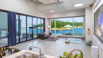 Quarto superluxo | Área de estar | TV de tela plana