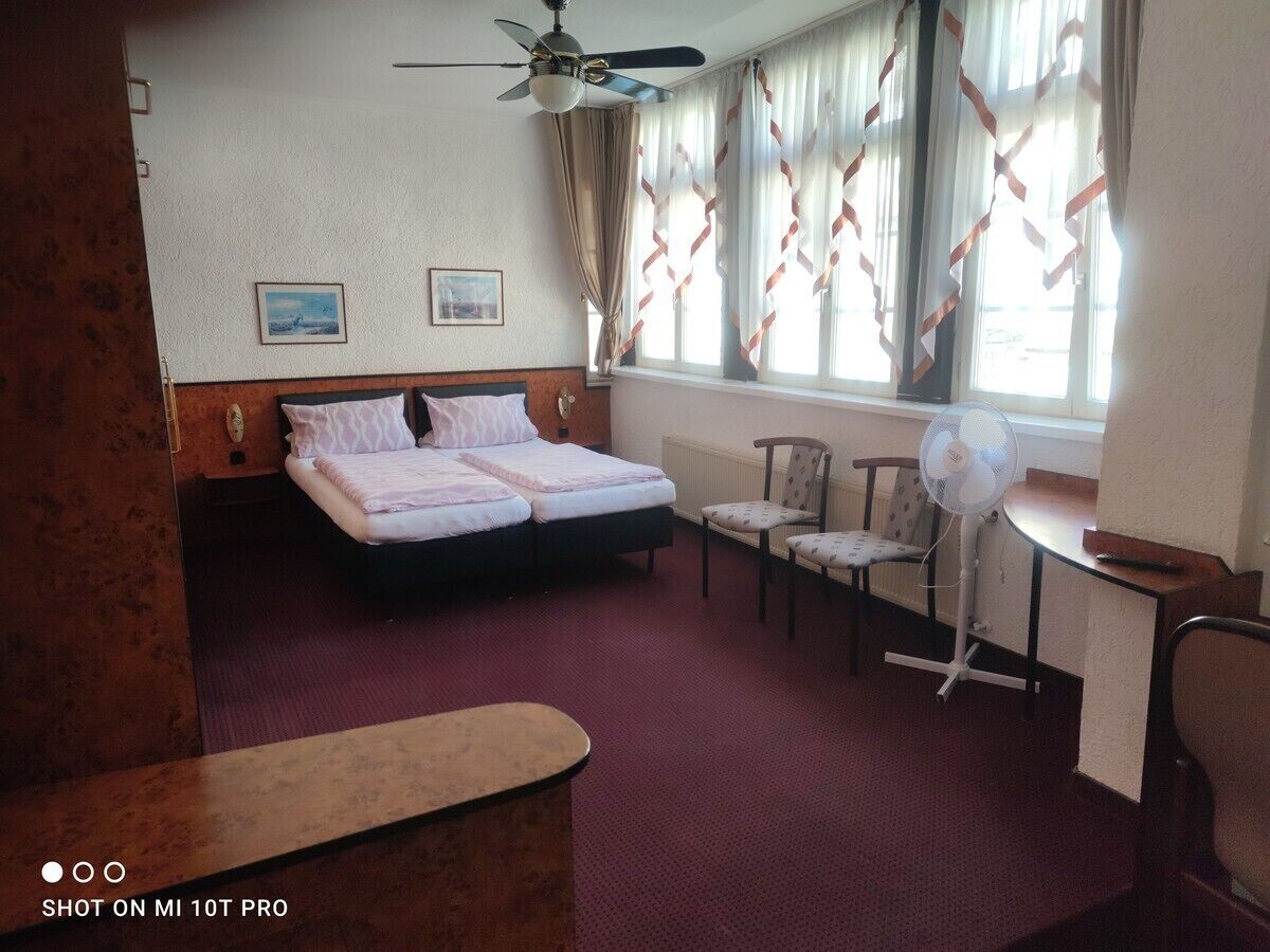 Quarto quádruplo standard, banheiro privativo, vista para a cidade | Comodidades do quarto