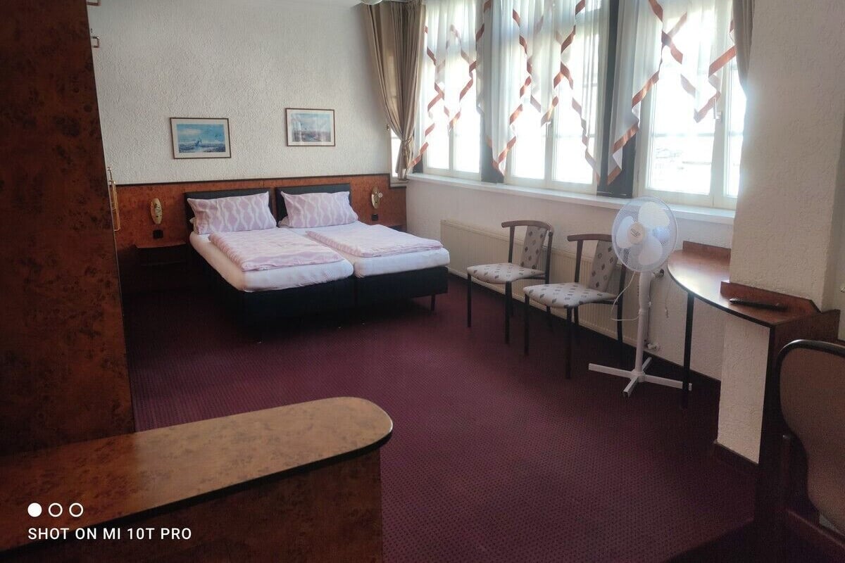 Quarto quádruplo standard, banheiro privativo, vista para a cidade | Comodidades do quarto