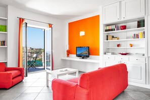 Apartamento, 1 quarto (Boheme) | Sala de estar | Televisor 