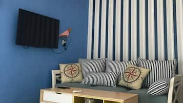 Casa com design assinado, 4 quartos | Sala de estar | TV