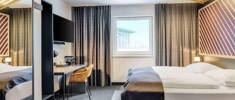 Secretária, quartos insonorizados, Wi-fi grátis