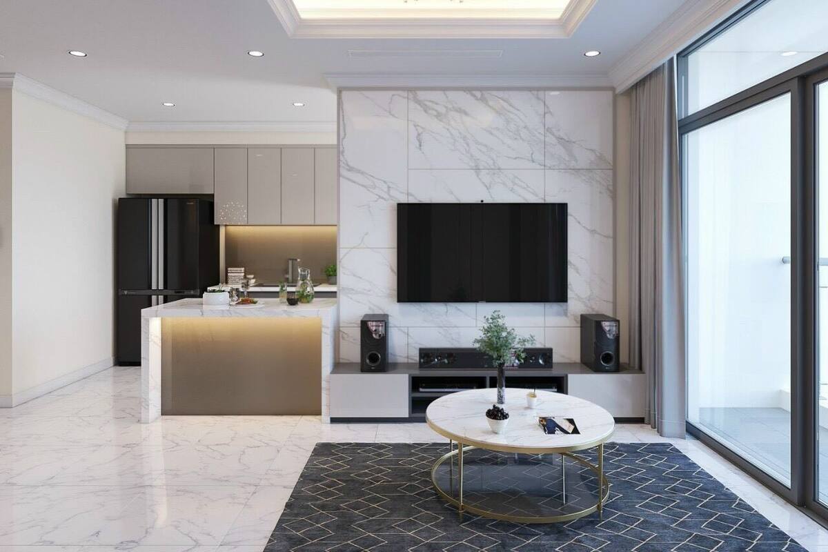 Sala de estar moderna com piso de mármore, uma mesa de centro redonda, uma TV de tela plana na parede e uma grande janela com vista para o exterior.