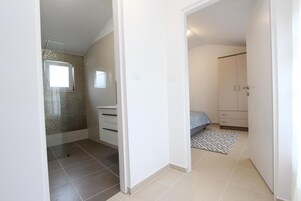 Apartamento, 1 quarto | Área de estar | TV de tela plana
