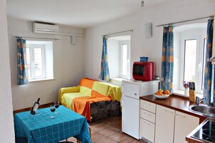 Apartamento (1) | Área de estar | TV de tela plana