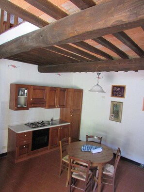 Apartamento, 1 quarto | Cozinha privada | Geladeira grande, fogão, cooktop, máquina de café expresso