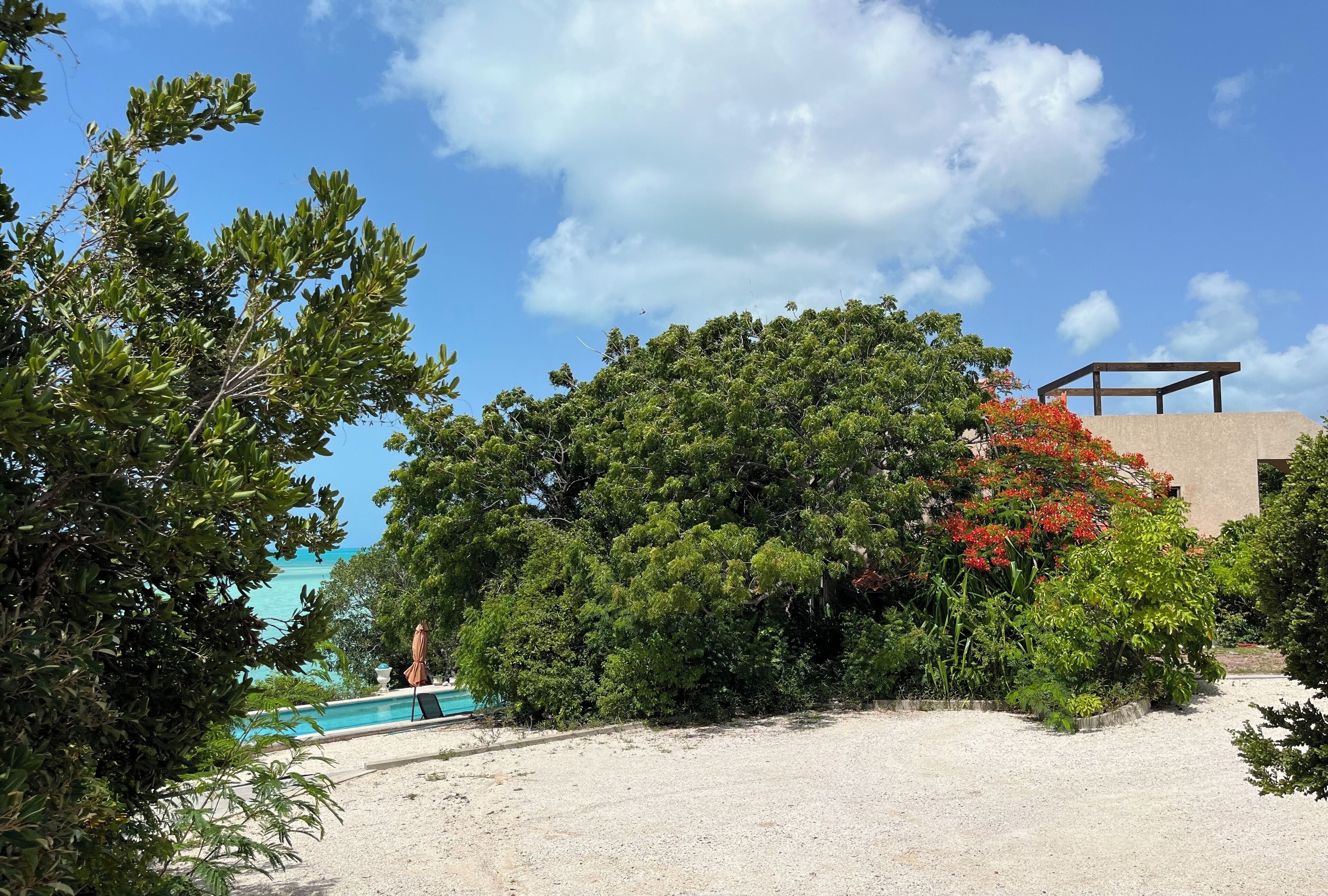 Beach and Silly Cay Inlet face the tranquil waters of the Caribbean Sea ...