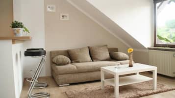 Apartamento Empresarial | Sala de estar | Televisor
