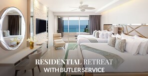 Quarto de hotel com cama, escrivaninha, cadeira, televisão e vista para o mar.