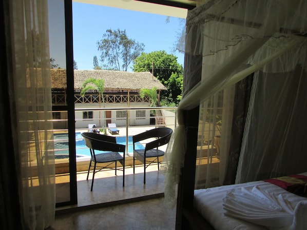 Quarto solteiro conforto, 1 cama King | Vista da sacada