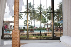 Quarto Individual Deluxe, 1 quarto, varanda, junto à praia | Vista para a praia ou o mar