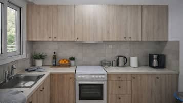 Apartamento | Cozinha privada | Geladeira grande, cooktop, cafeteira/chaleira, chaleira elétrica