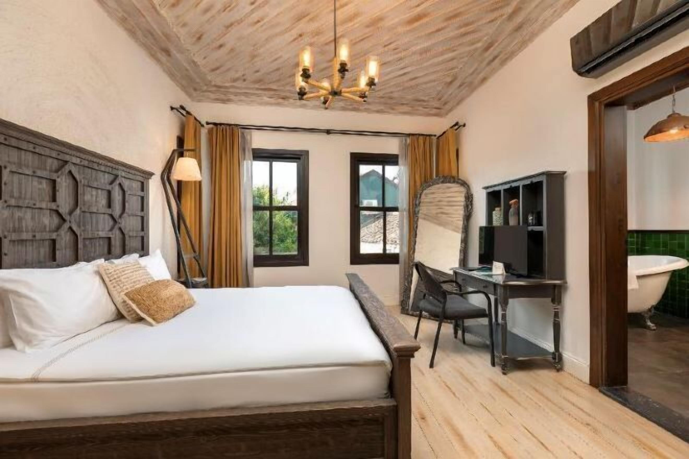 Roupas de cama premium, camas Tempur-Pedic, frigobar, cofres nos quartos