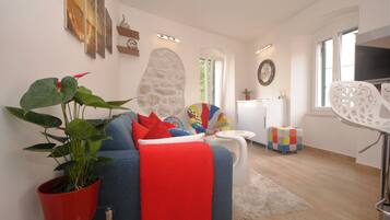 Apartamento Deluxe | Sala | Smart TV