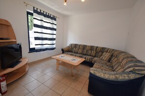 Apartamento (A1) | Sala de estar | TV de ecrã plano 