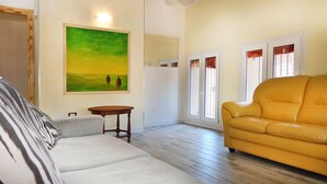 Apartamento Superior | Sala | TV de ecrã plano 