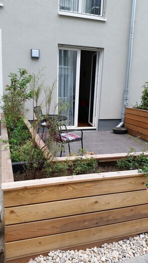 Apartamento design, acessível, vista para o jardim | Terraço/pátio