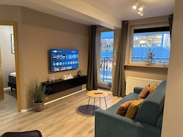 Apartamento conforto | Área de estar | TV de tela plana