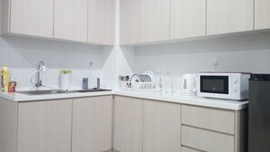 Apartamento família, várias camas, vista para a montanha | Cozinha americana privada