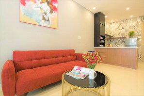 Apartamento, 2 quartos | Área de estar | TV de tela plana