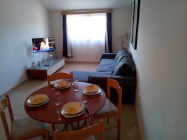 Apartamento urbano | Área de estar | TV de tela plana